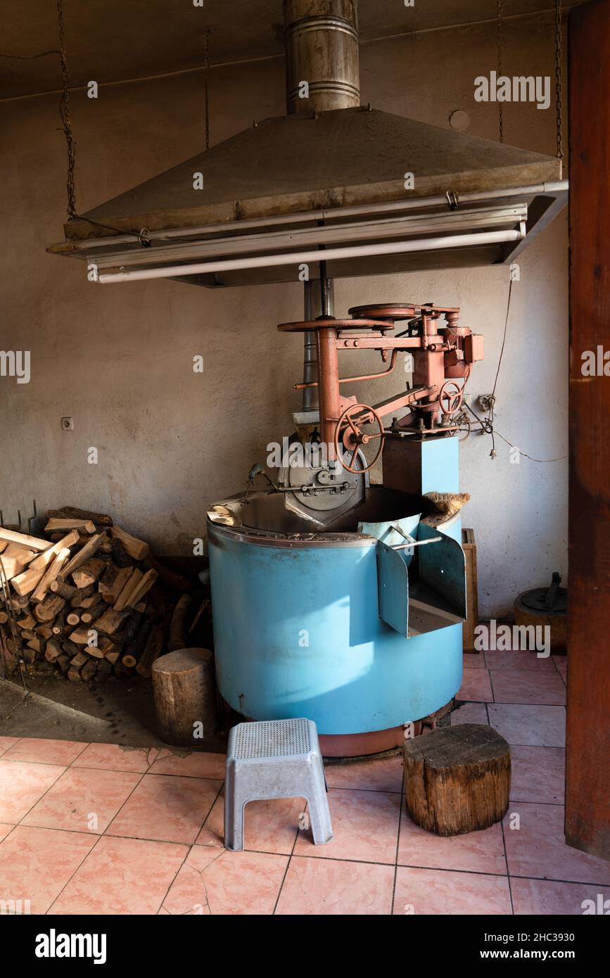 Metal roasting machine. Roasting chickpeas machine runs by burning wood ...