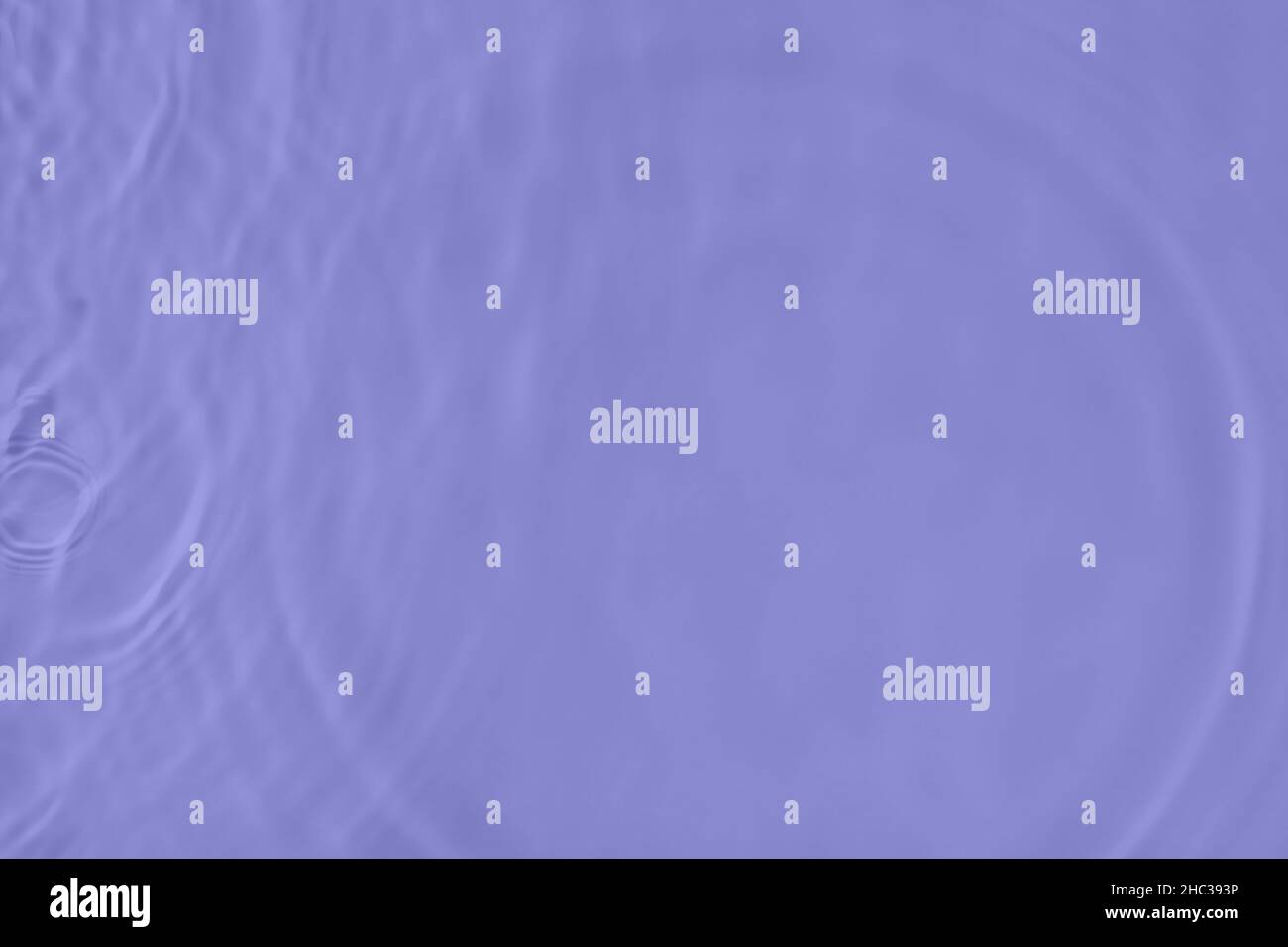 The surface of light on the purple transparent swimming pool water ...