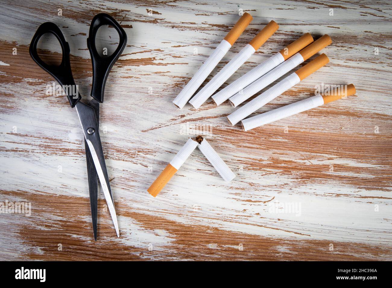 Scissors cut a cigarettes. Addiction, health and treatment concept ...