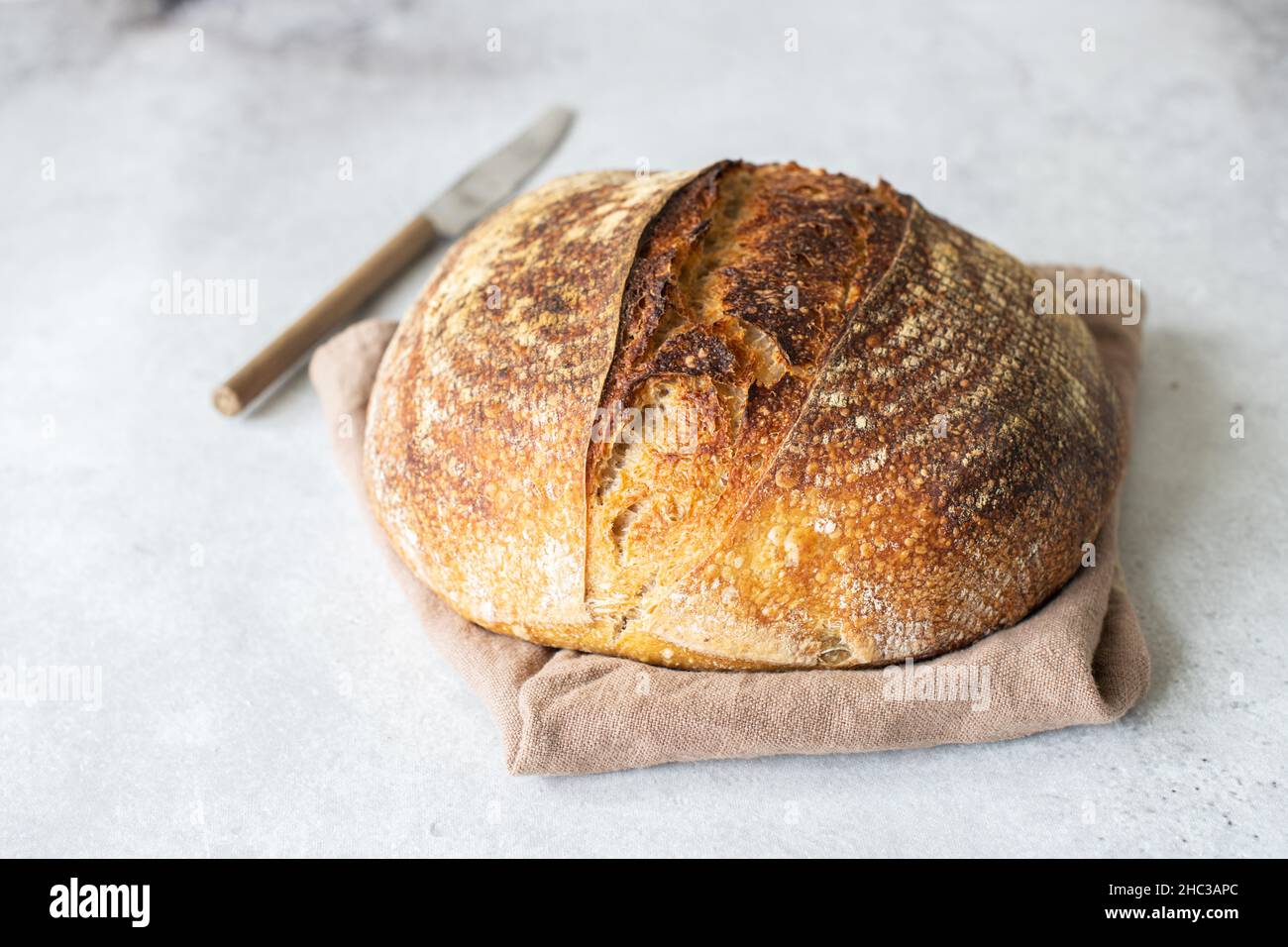 Homemade artisanal sourdough bread. Healthy home baking concept Stock ...
