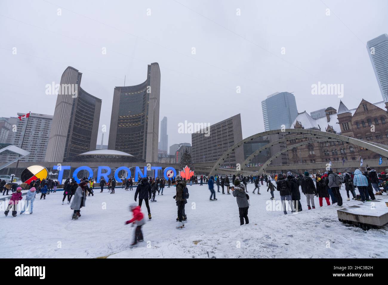 Toronto, Ontario, Canada - December 18 2021 : People doing ice skating ...