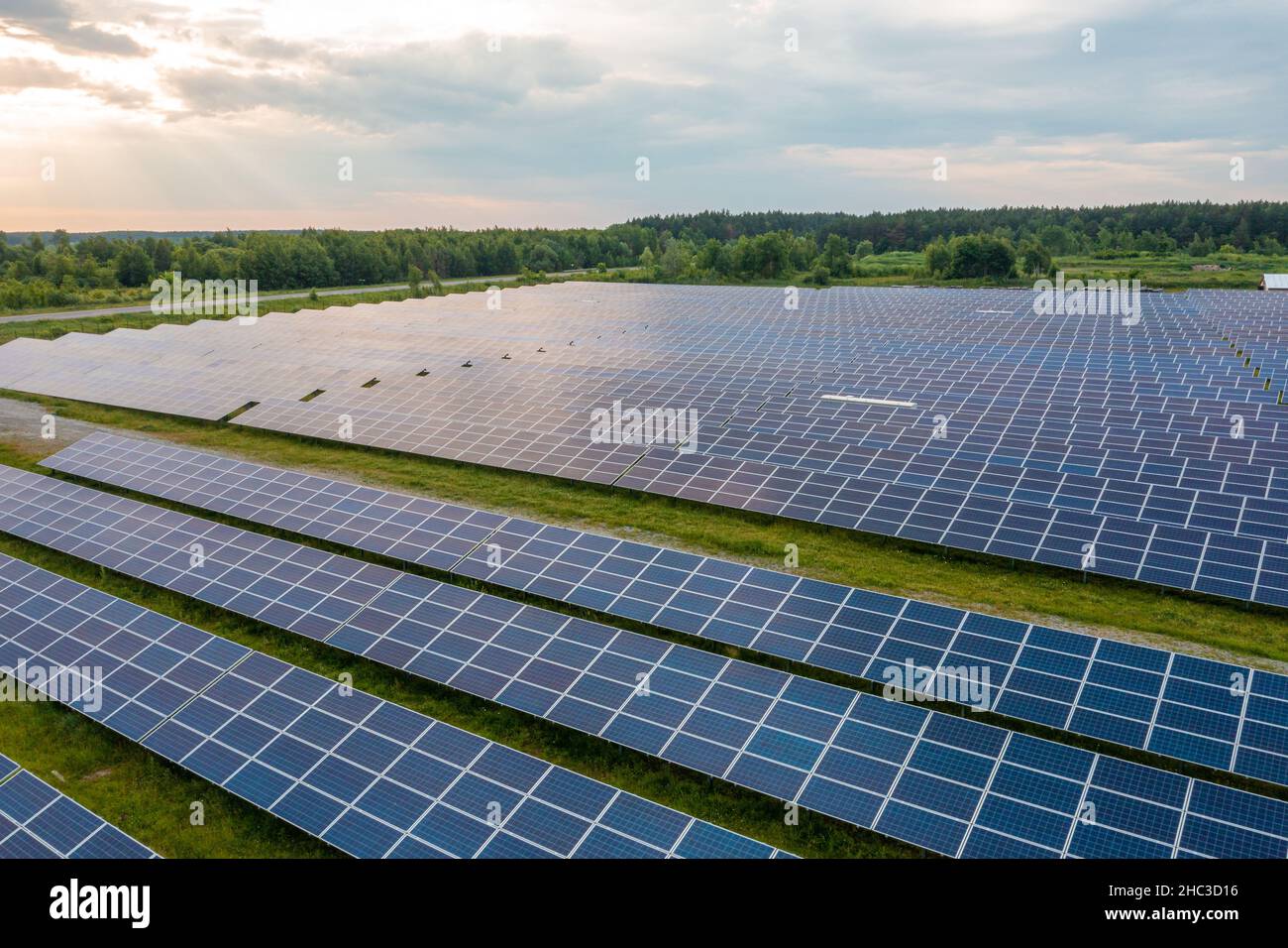 Huge solar power plant to use solar energy in a picturesque green field ...