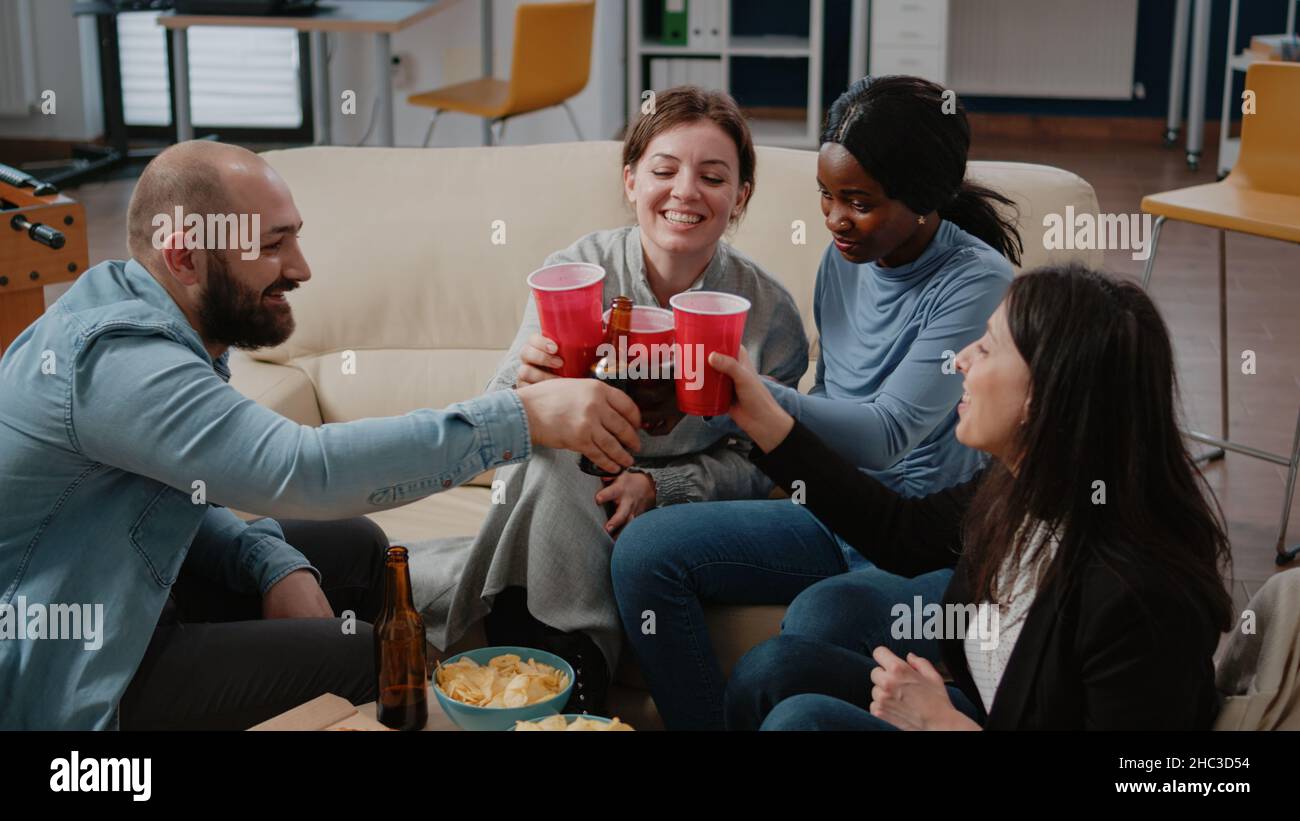 Diverse group workers clinking cups hi-res stock photography and images ...