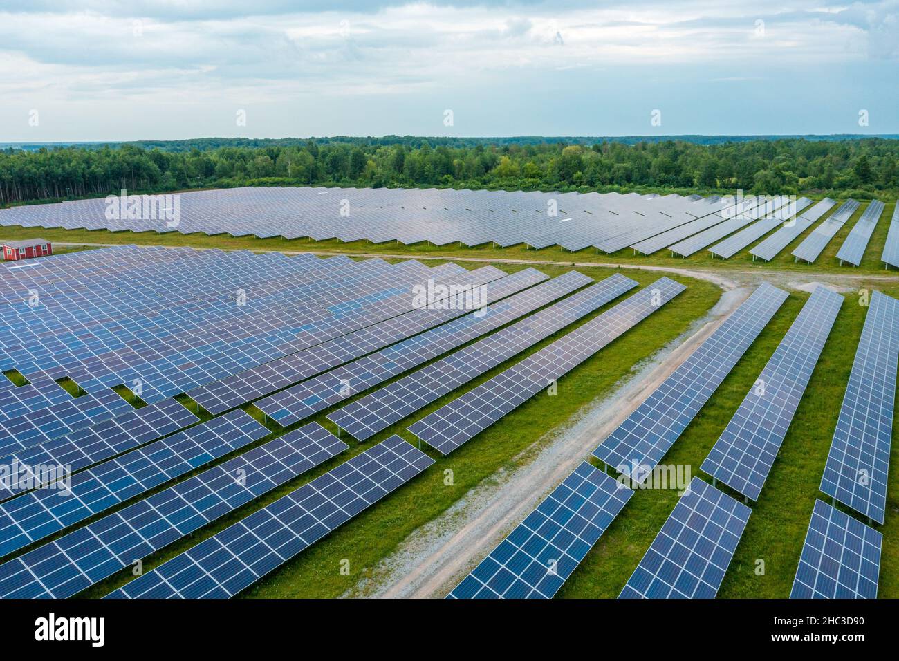 Huge solar power plant to use solar energy in a picturesque green field ...
