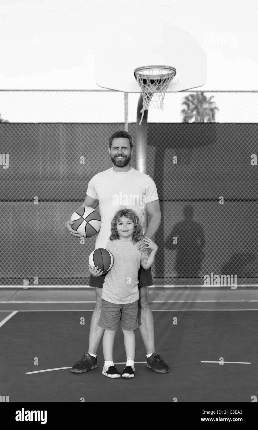 happy fathers day. happy family. dad and kid boy play basketball. child ...
