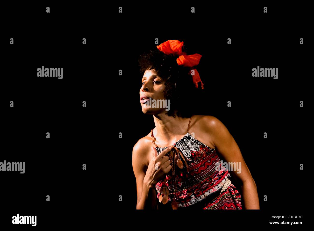 Actress on stage represents a dramatic character. She is standing ...