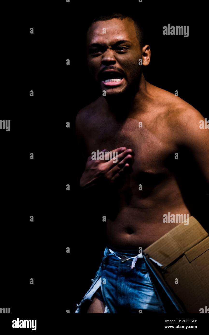 Actor on stage represents a dramatic character. Scene in a theater in ...