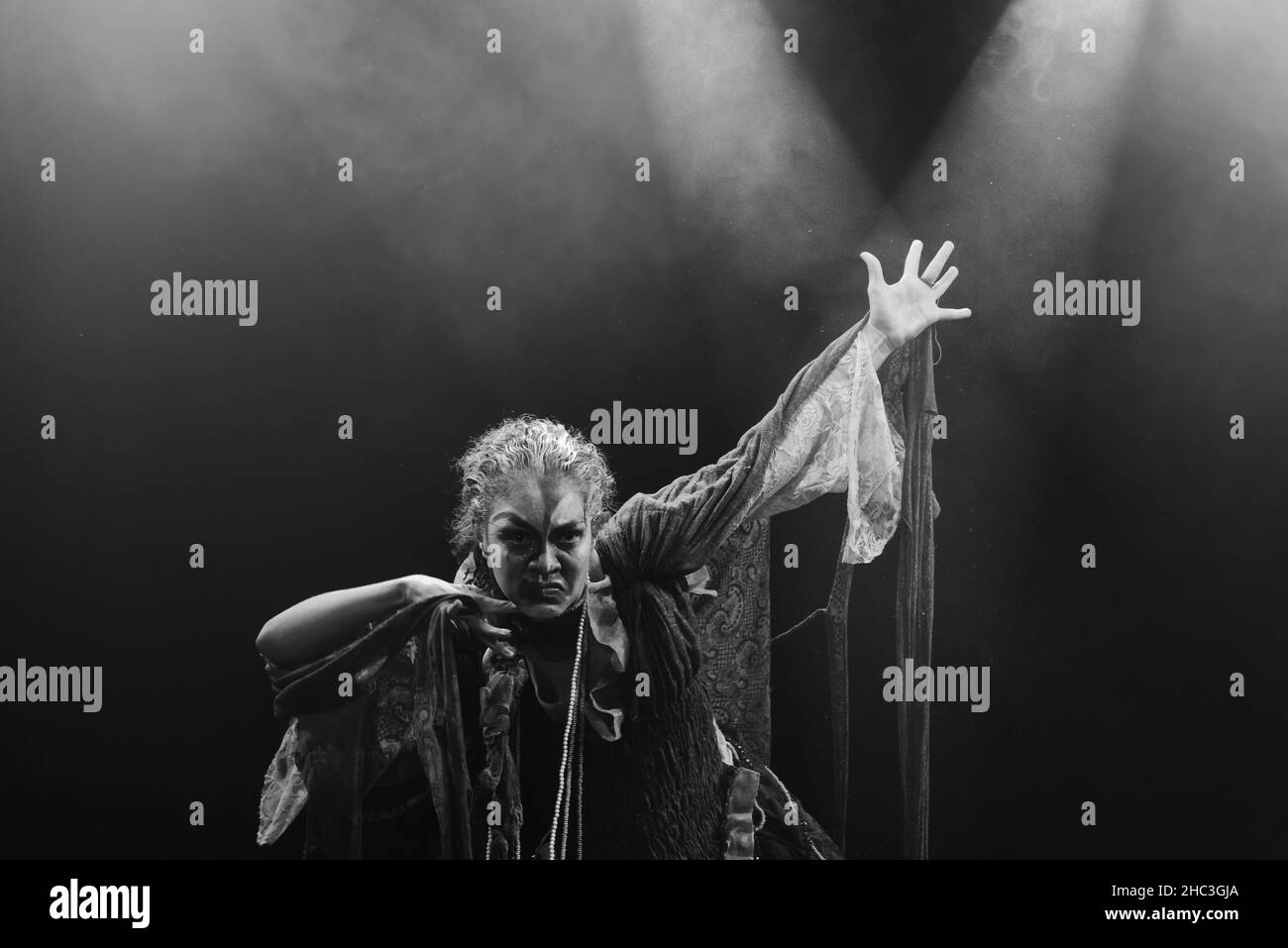 actress representing a character on the stage of a theater. He makes ...