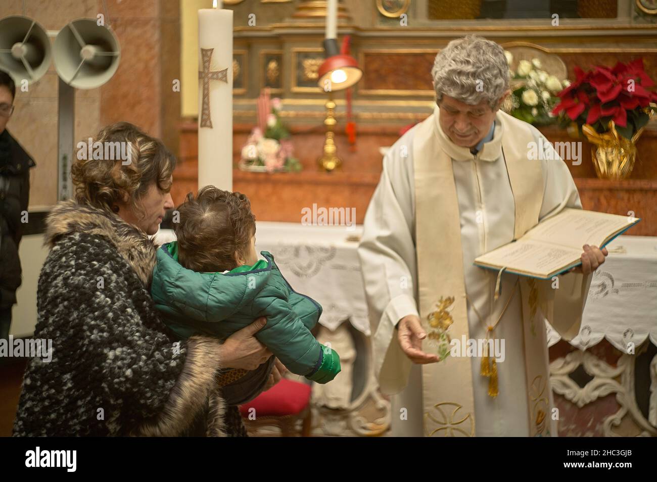 Priest catholic baptism hi-res stock photography and images - Alamy