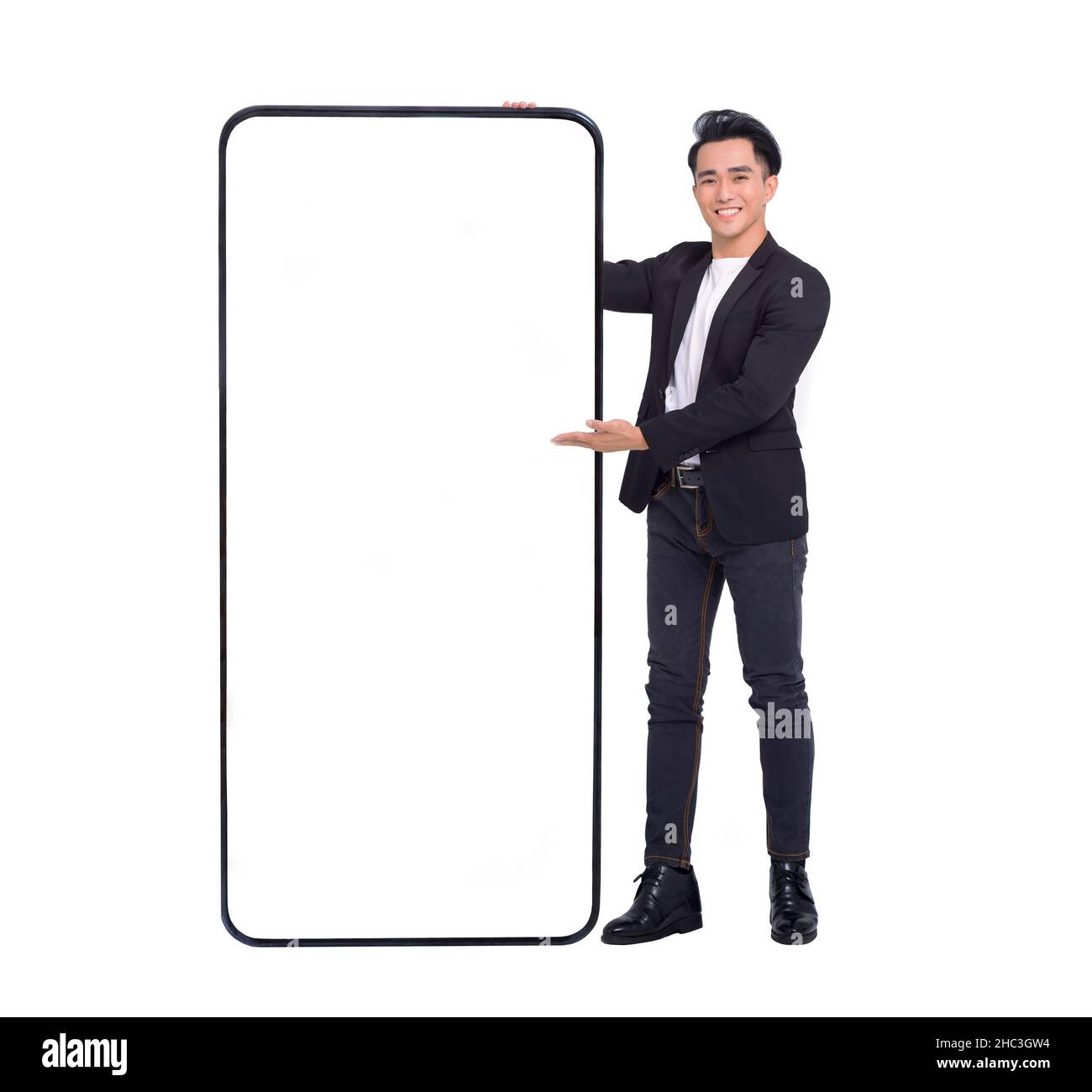 young man standing and showing big Smartphone With Blank White Screen ...