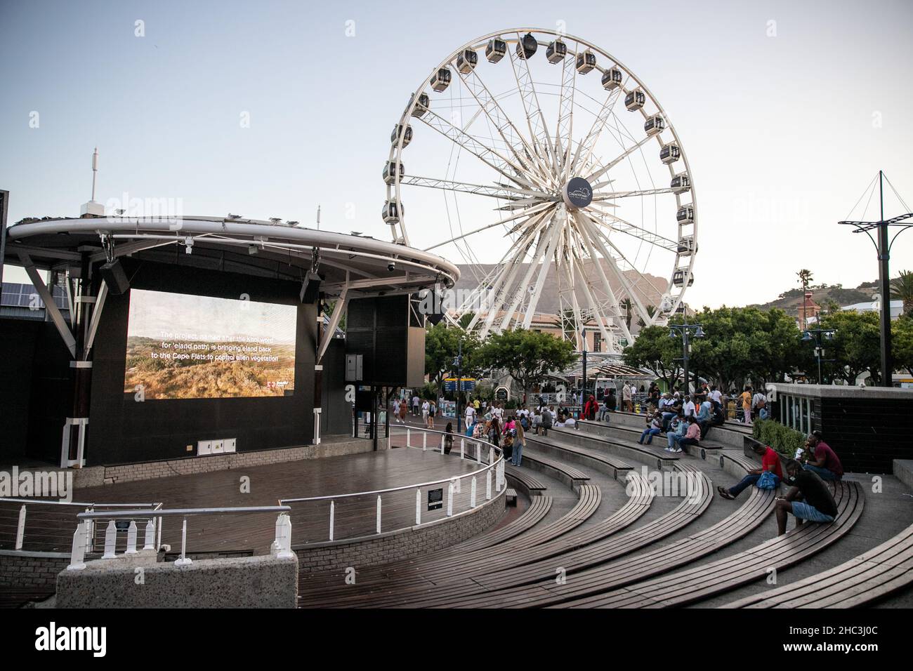 Cape Town, South Africa. 23rd Dec, 2021. Visitors sit at an ...