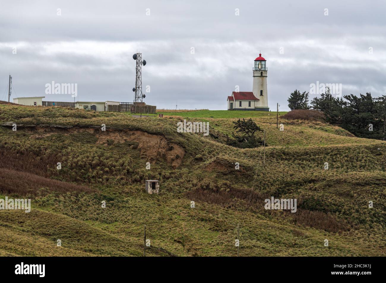 The Cape Blanco Lighthouse atop a hill on the coast of Oregon, USA ...
