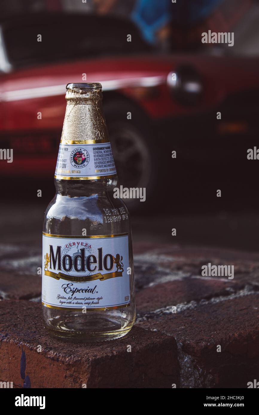 Bottle of beer with background car Stock Photo - Alamy