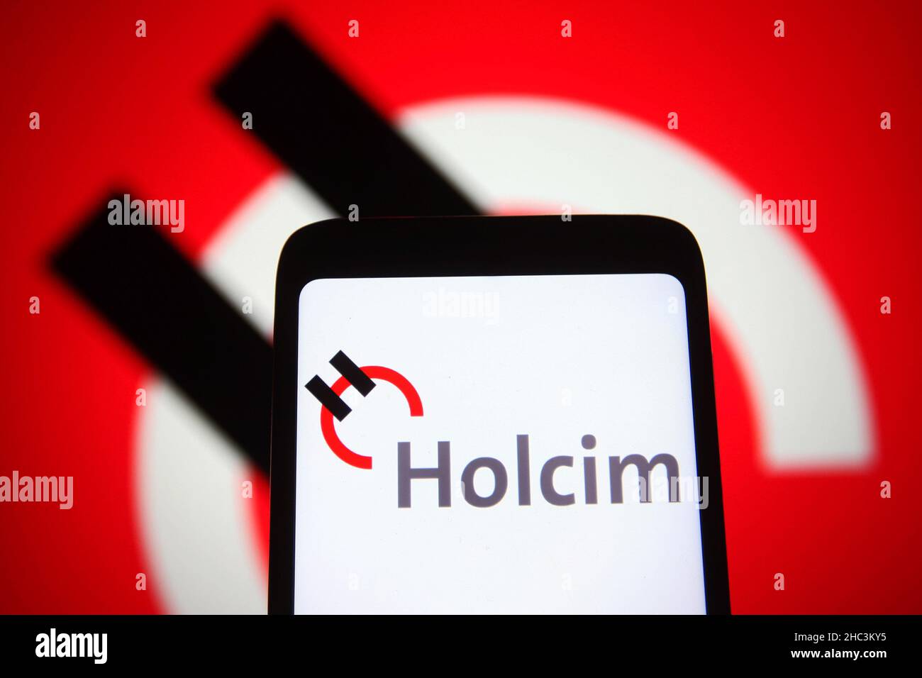In this photo illustration, The Holcim Group (Holcim Limited) logo is ...