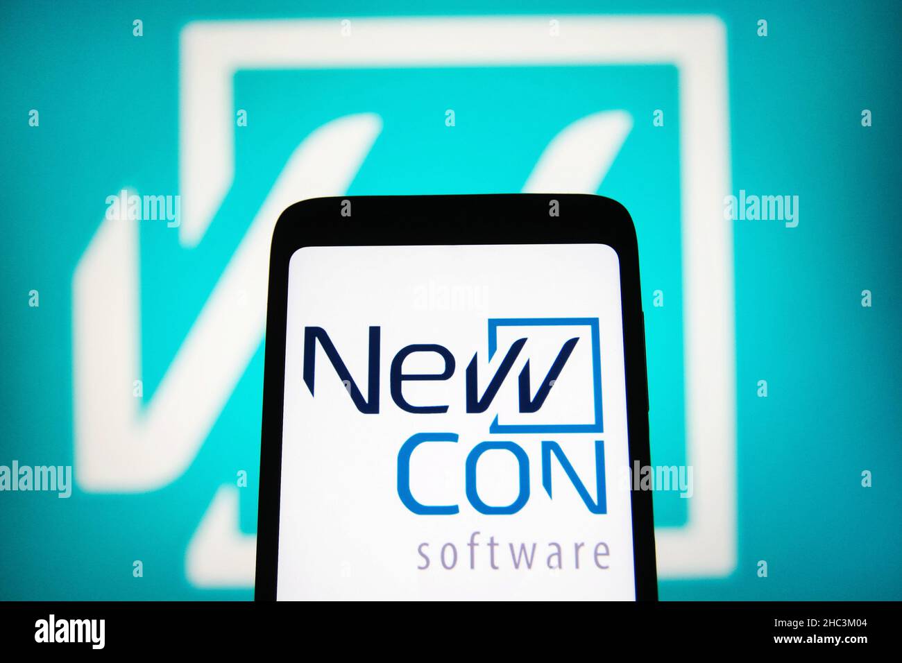 In this photo illustration, a Newcon Software SA logo is seen on a smartphone screen. (Photo by ...