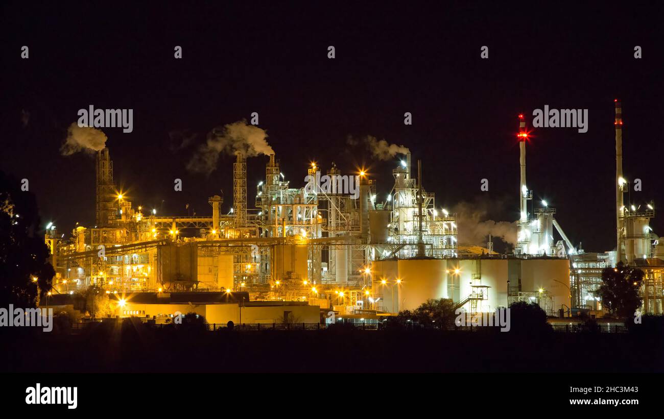 Oil Refinery in Sarroch, Sardinia, Italy at night Stock Photo - Alamy