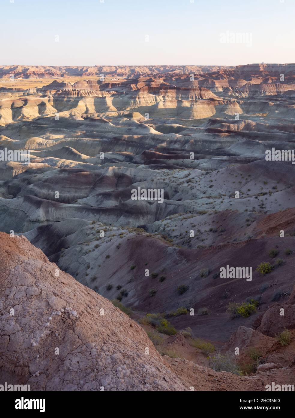 Dry, cracked, reddish soil at the edge of the overlook of the Little ...