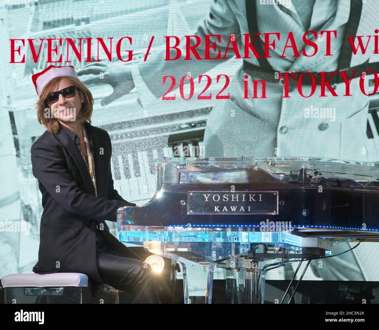 Tokyo, Japan on December 23, 2021: Yoshiki of X Japan plays piano during a press conference for ...