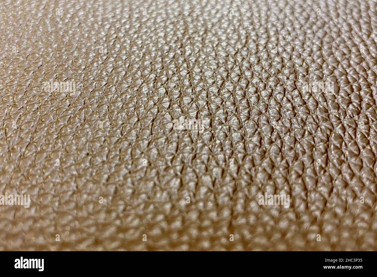 Blurred background of brown fine leather background Stock Photo - Alamy