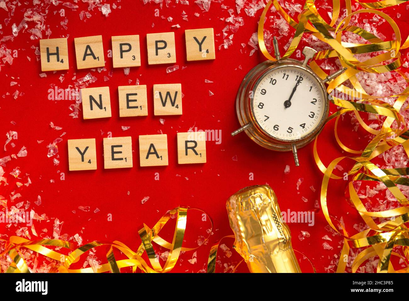 Red Christmas theme background with lettered wooden tiles forming the ...