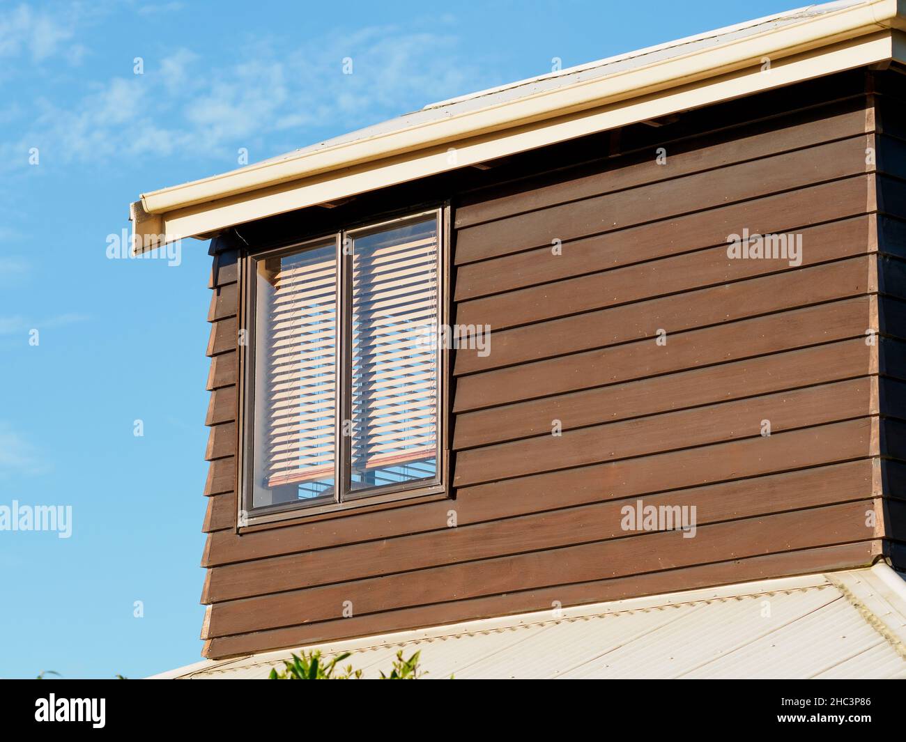 View of house extension with one window and wooded weatherboards Stock ...
