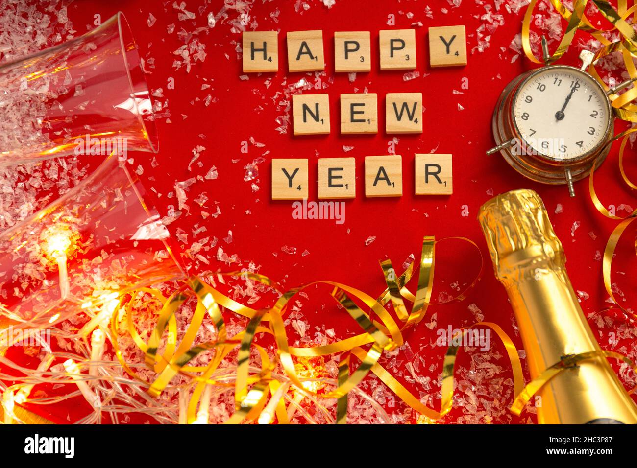 Red Christmas theme background with lettered wooden tiles forming the ...