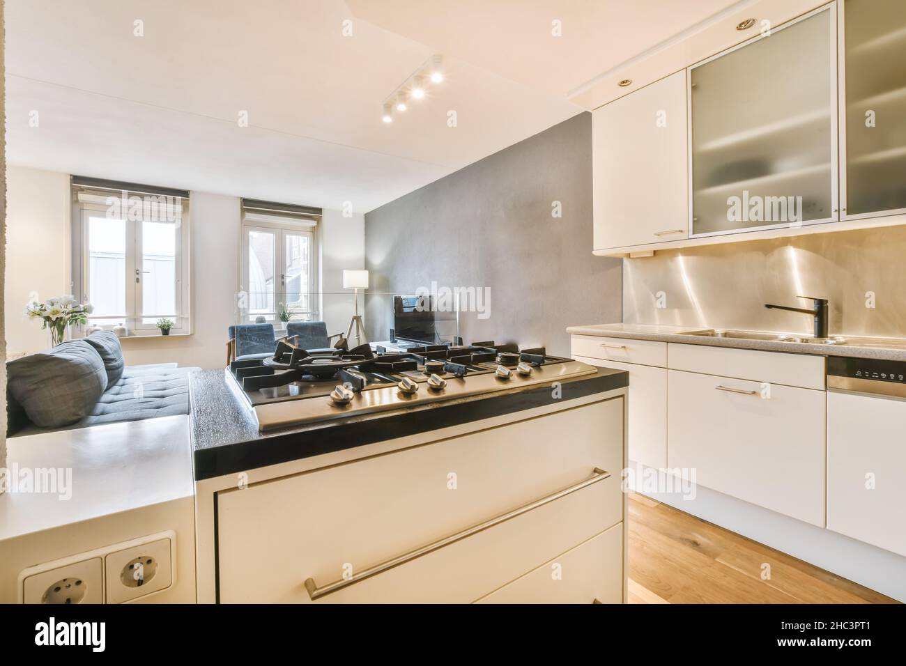 Delightful kitchen with lovely black and white designs Stock Photo - Alamy