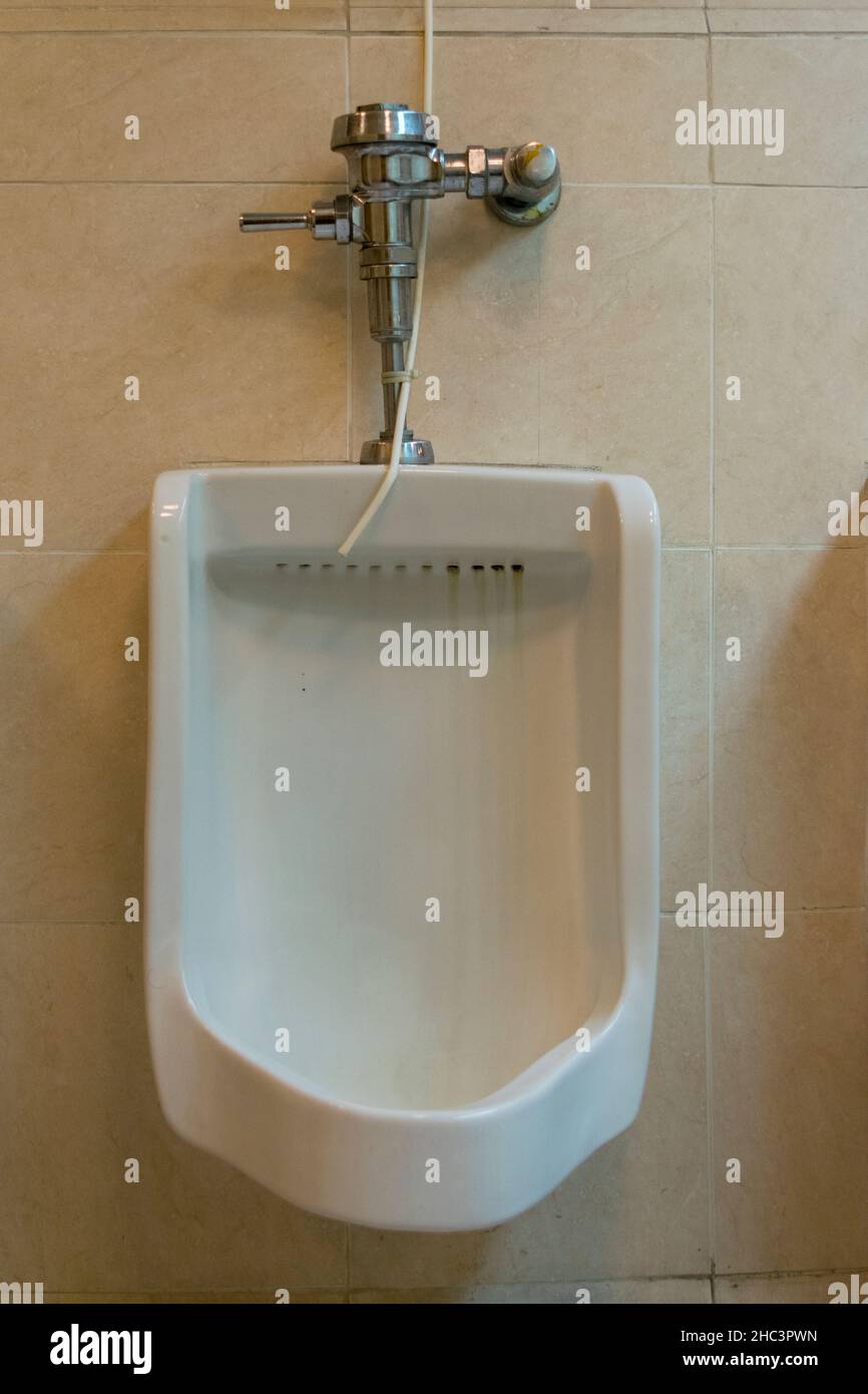 sanitary for men, urinal in public area in Guatemala Stock Photo - Alamy