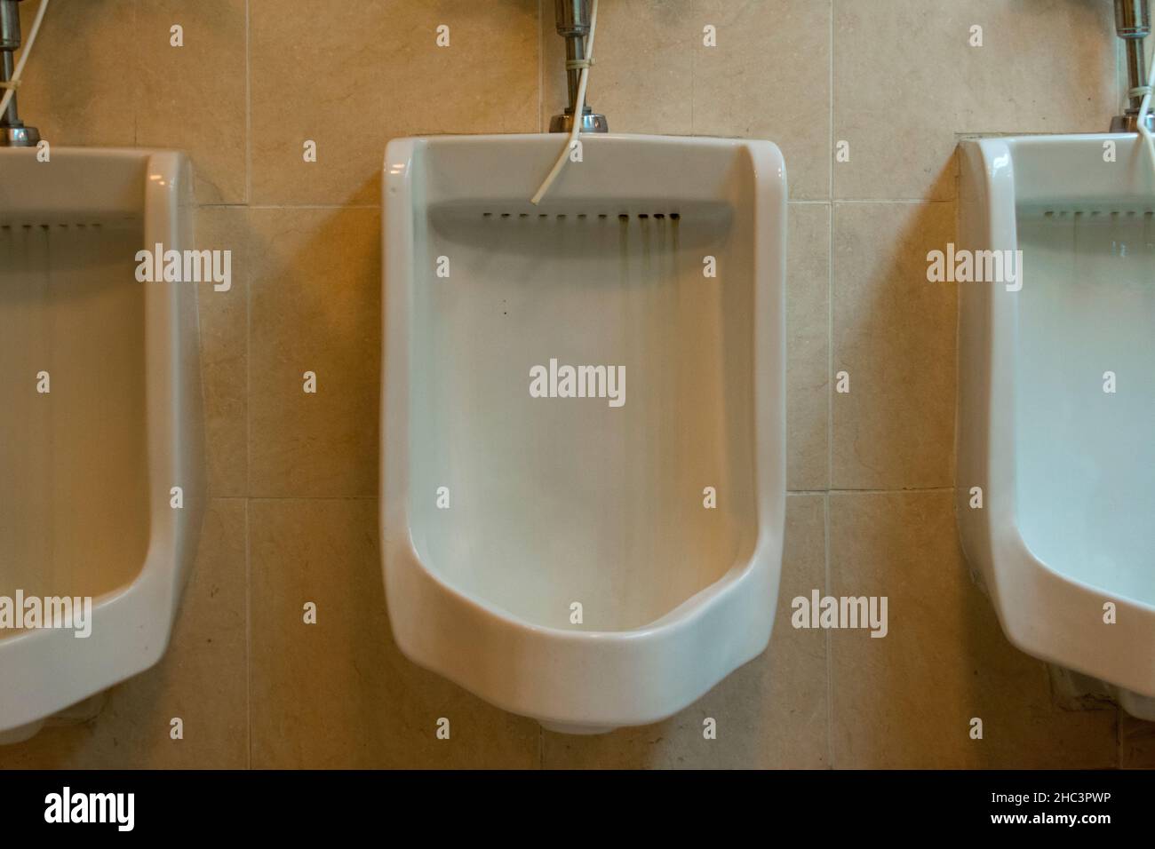 sanitary for men, urinal in public area in Guatemala Stock Photo - Alamy