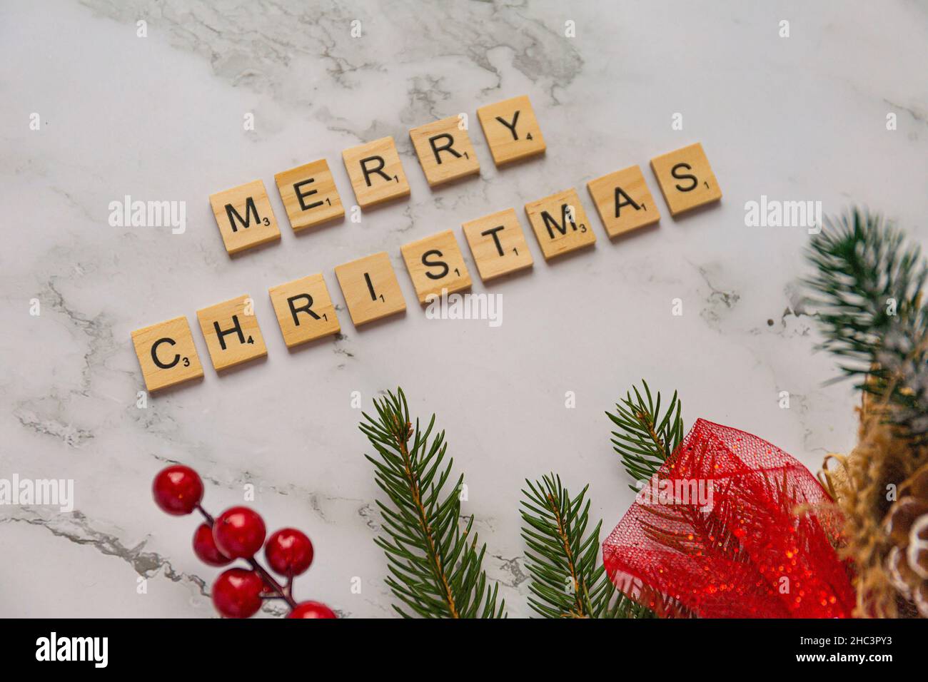 Lettered wooden tiles forming the Words Merry Christmas with christmas ...