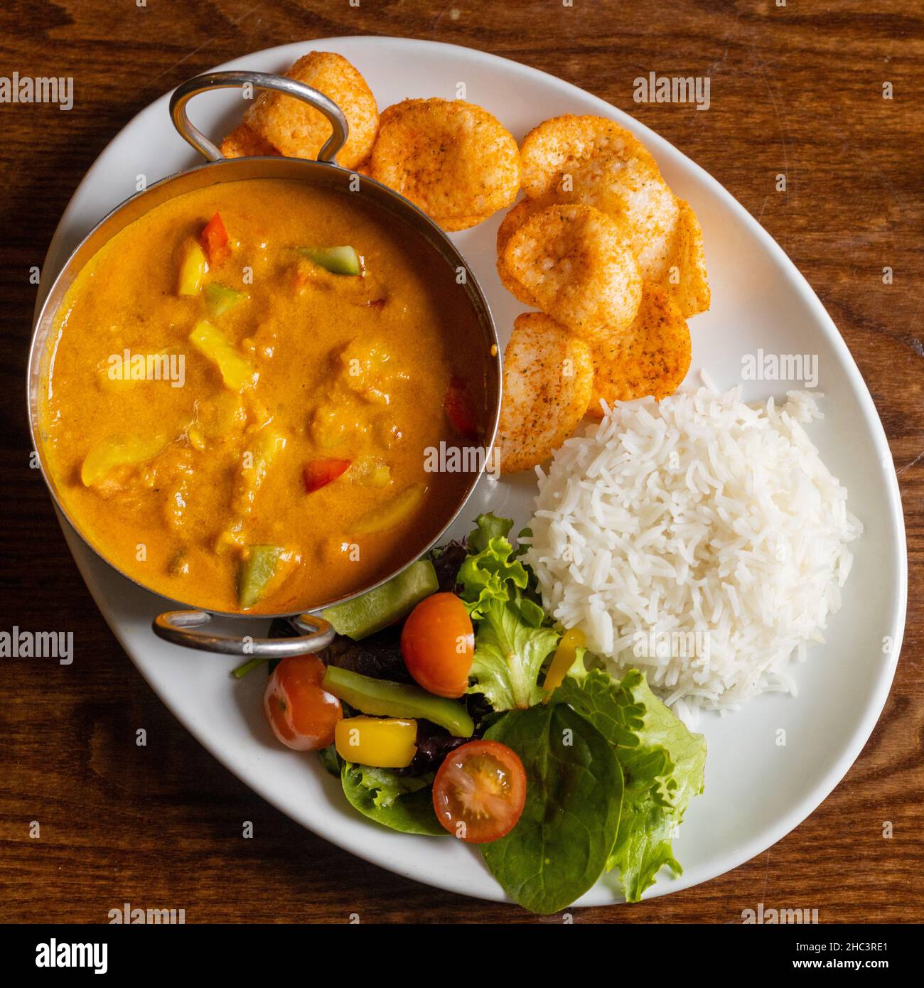Top view of traditional Indian lunch with soup, rice, and salad Stock ...