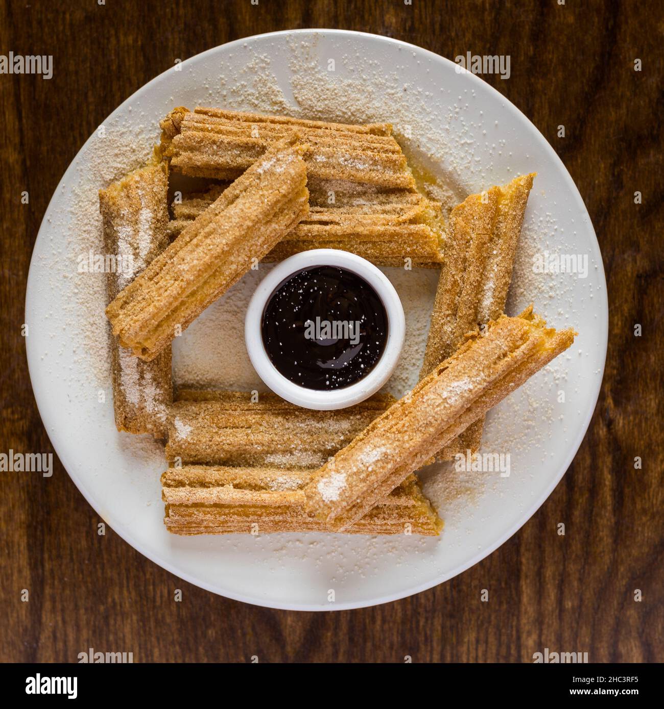 Top view of the Churros with sugar powder and chocolate sauce Stock ...