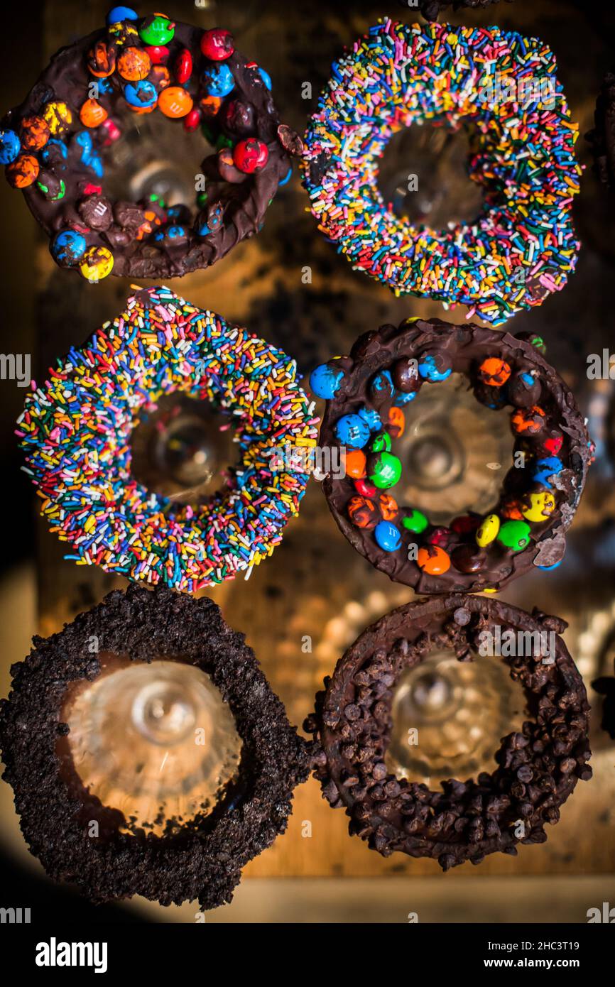 Vertical top view of drink glasses with chocolate and toppings around ...