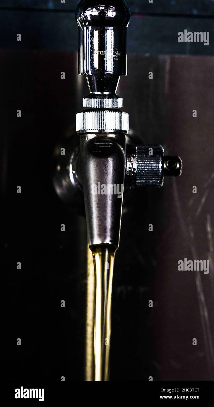 A vertical closeup of the beer tap on dark background Stock Photo - Alamy