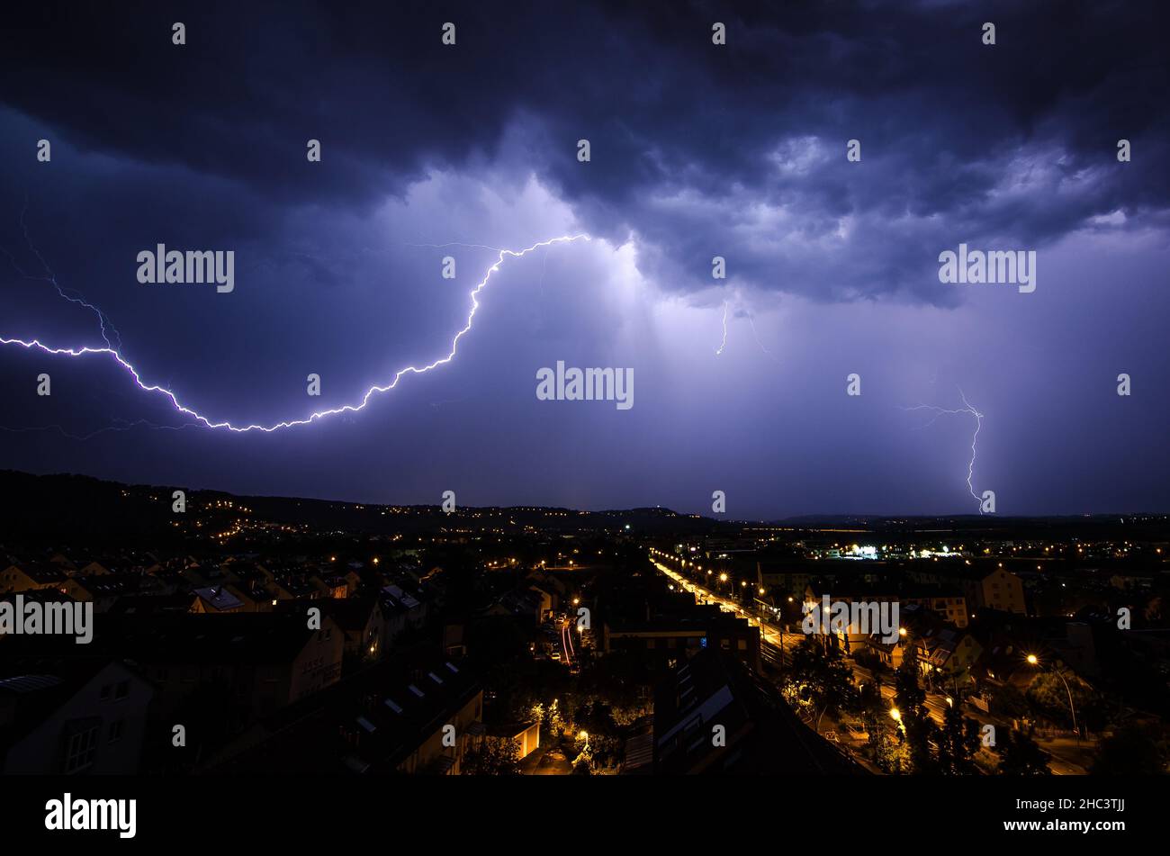 Beautiful scene of the lightning striking in the night sky over ...