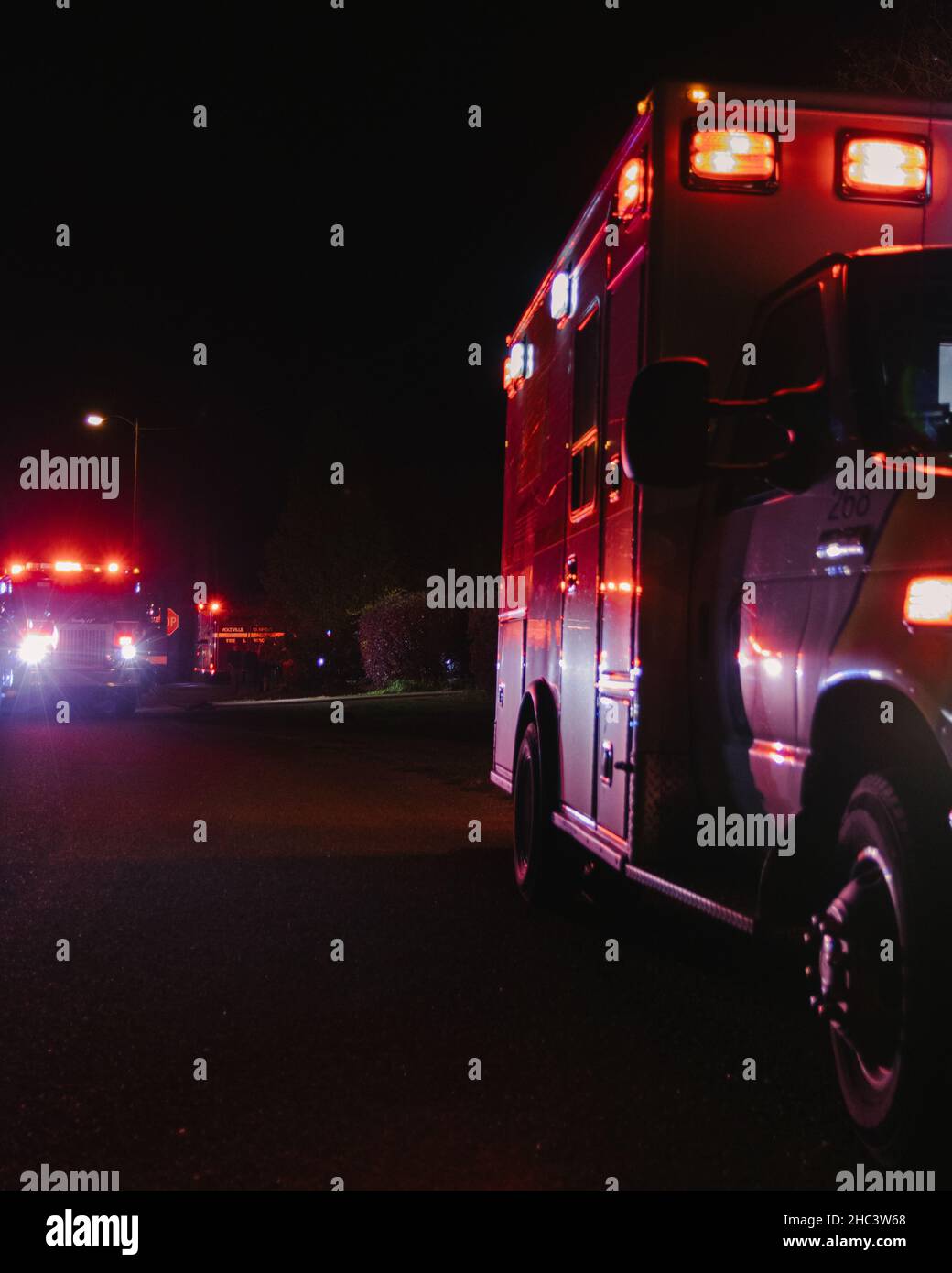 Vertical shot of fire engines at night Stock Photo - Alamy