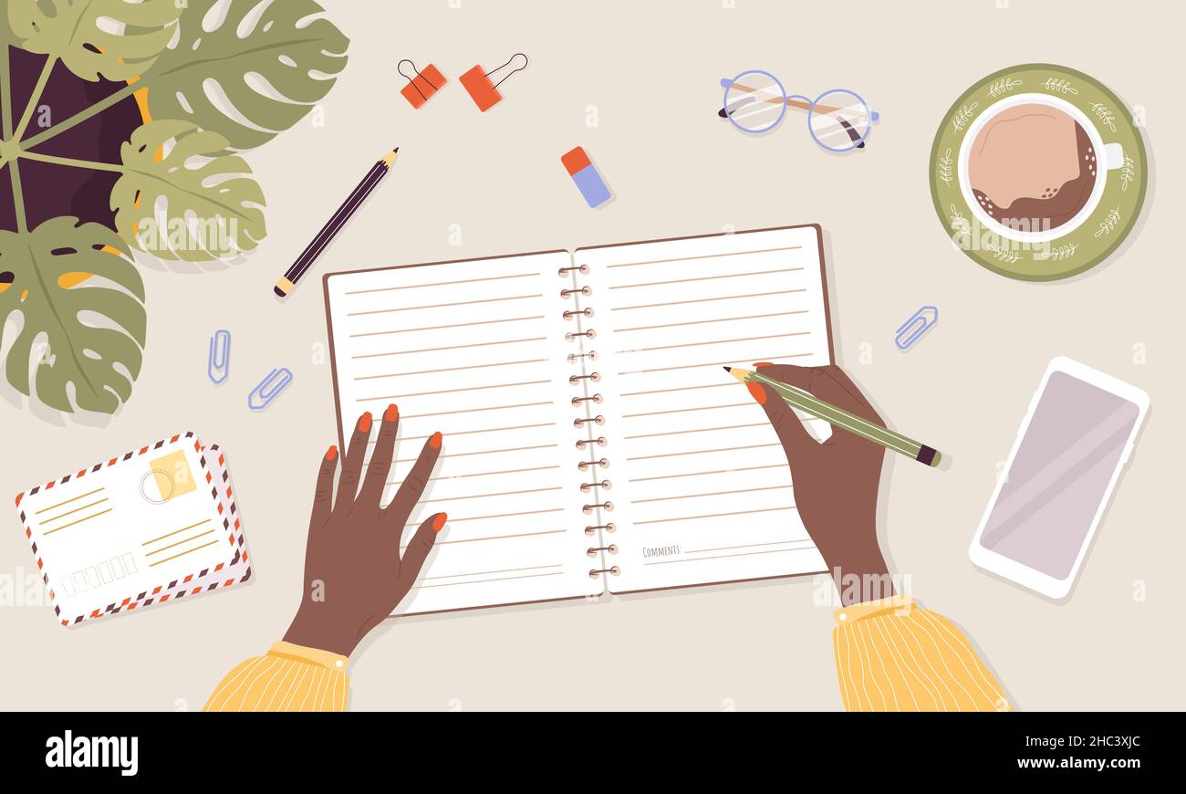 Open diary, planner or notebook concept. African woman write journal ...