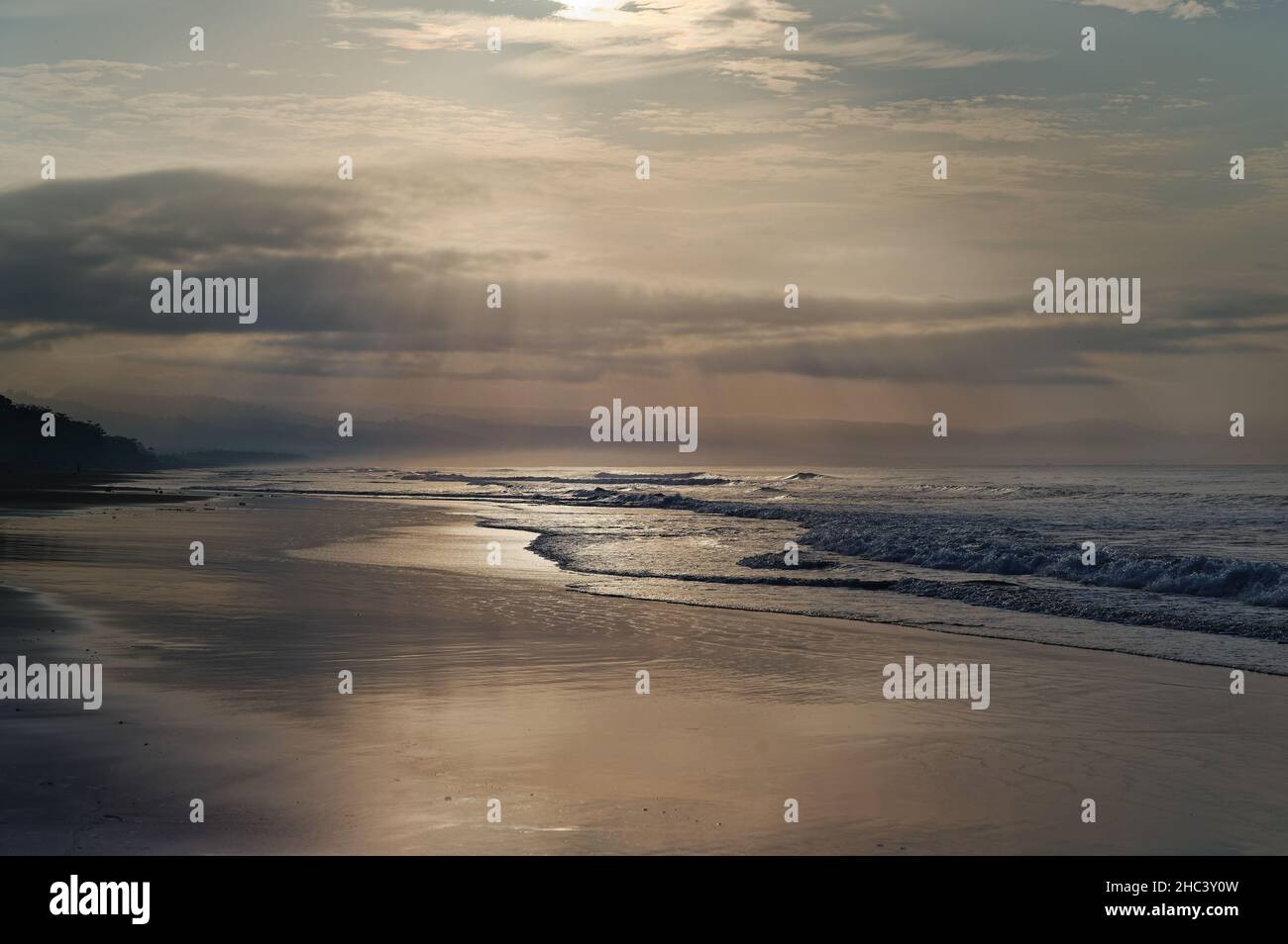 After sunrise , stunning light rays breaking through the dark clouds ...