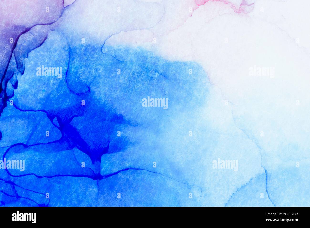 Macro close-up of blue alcohol ink layers and splashes, abstract ...