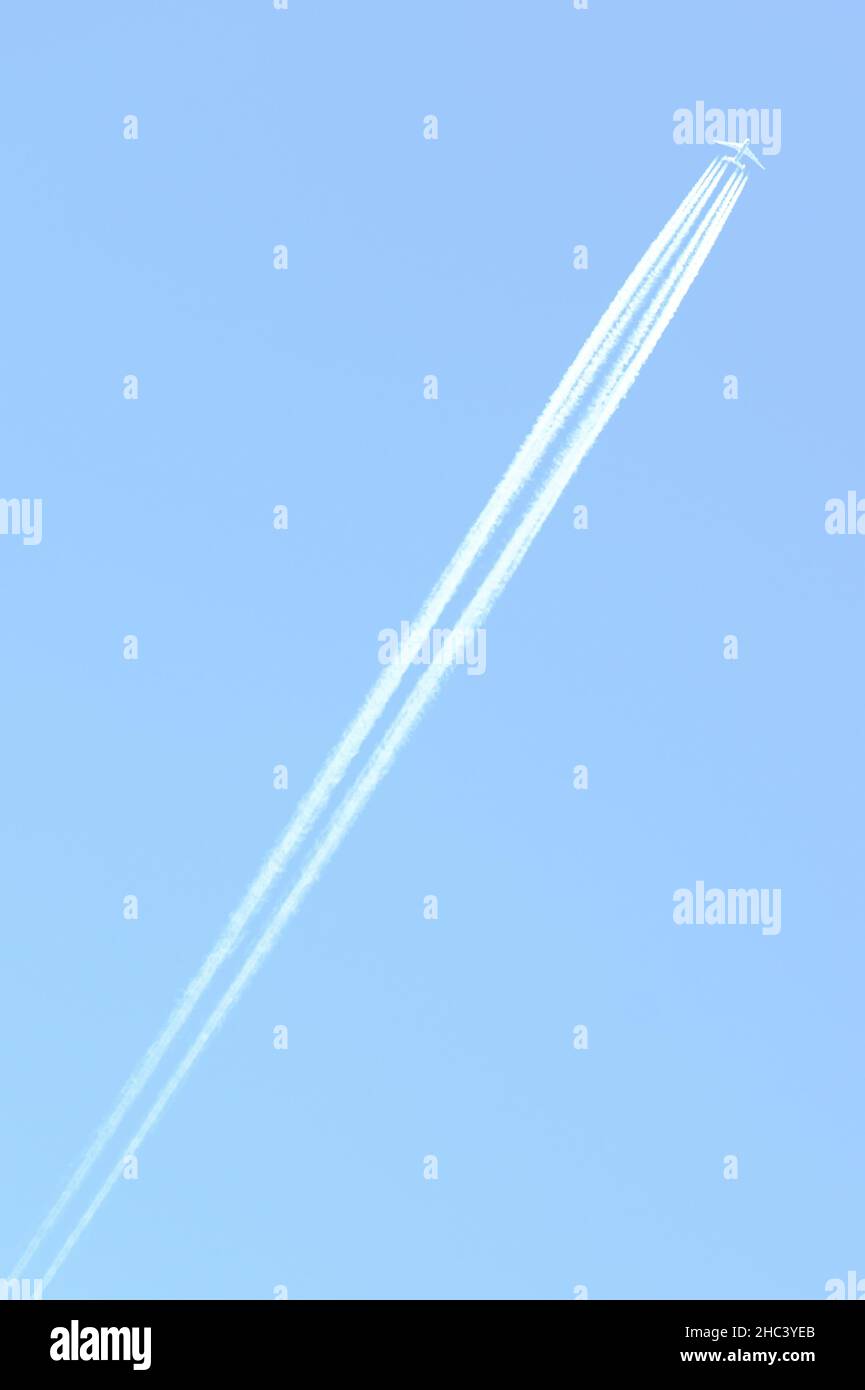 Traces and white streaks from jet engines in the plane, white stripes ...