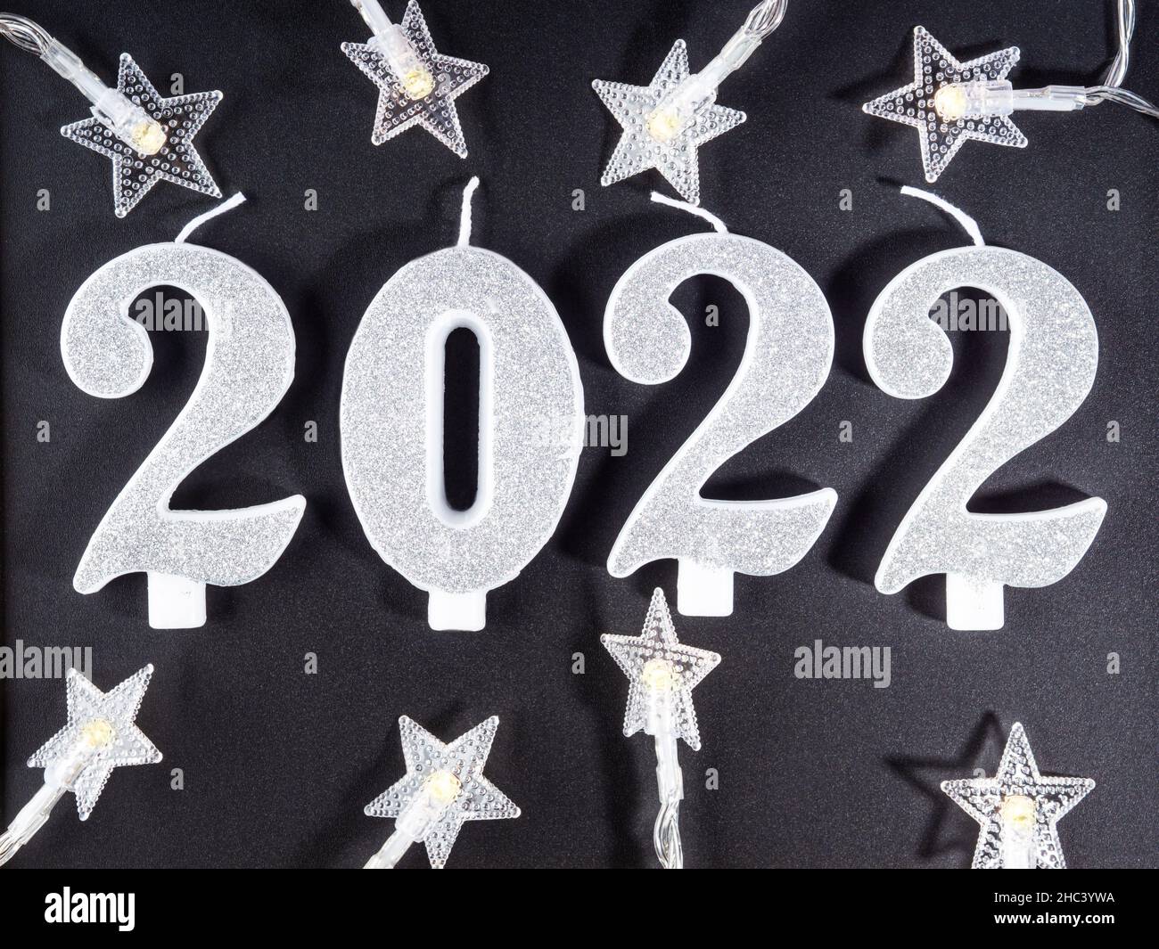 New year 2022 numbers on blackboard with star shape lights Stock Photo ...