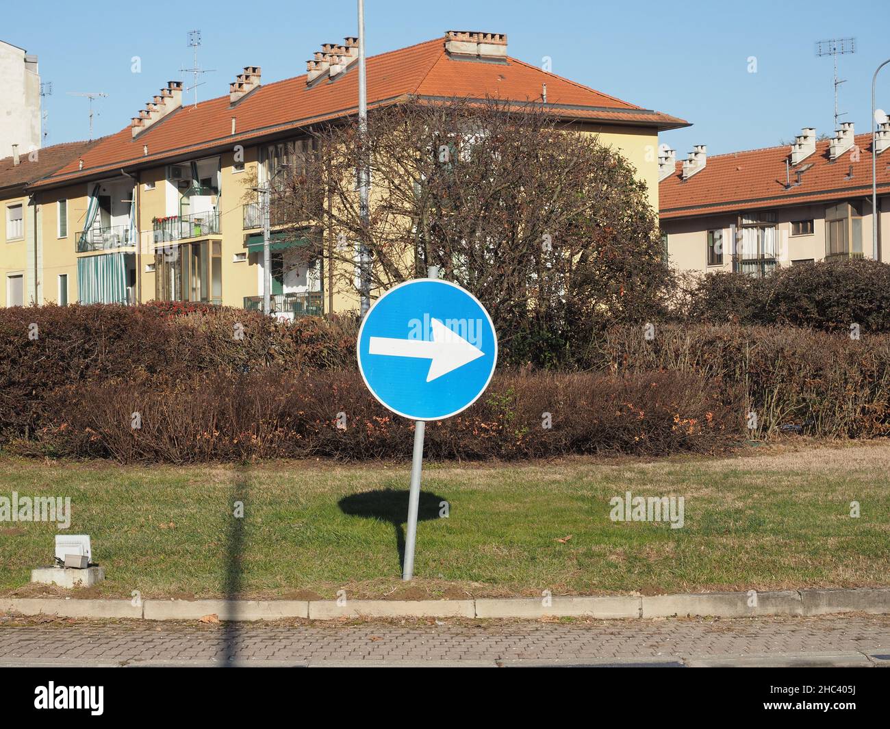 direction arrow traffic sign in a roundabout Stock Photo - Alamy