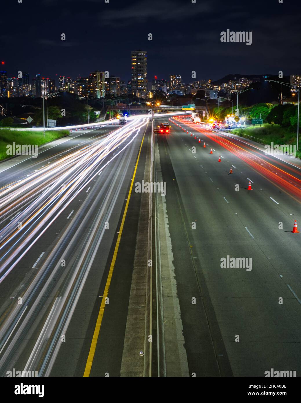 Vertical long exposure shot of car lights on a highway road Stock Photo ...