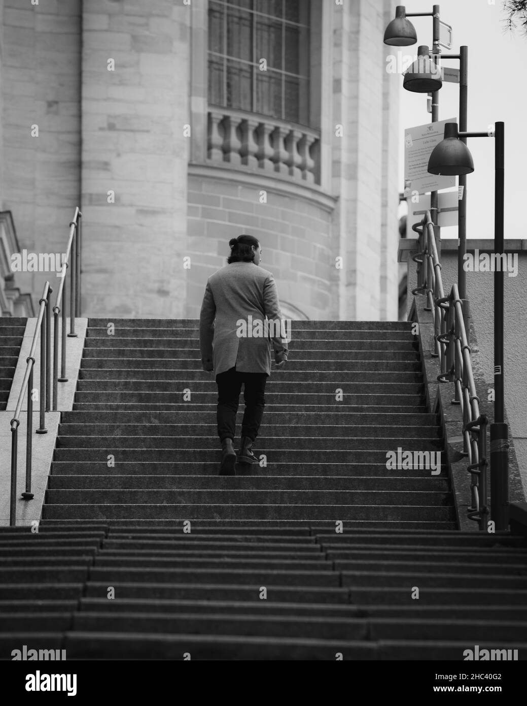 Man climbing stairs hi-res stock photography and images - Alamy