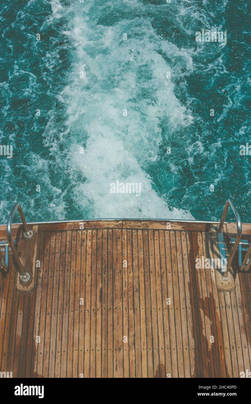 Vertical shot of a wooden dock by the sea with splashing waves Stock ...