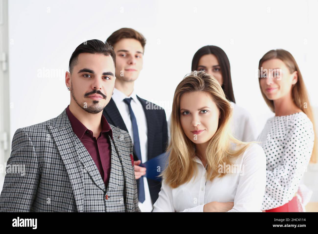 Smart confident team of successful people, coworkers pose for ...