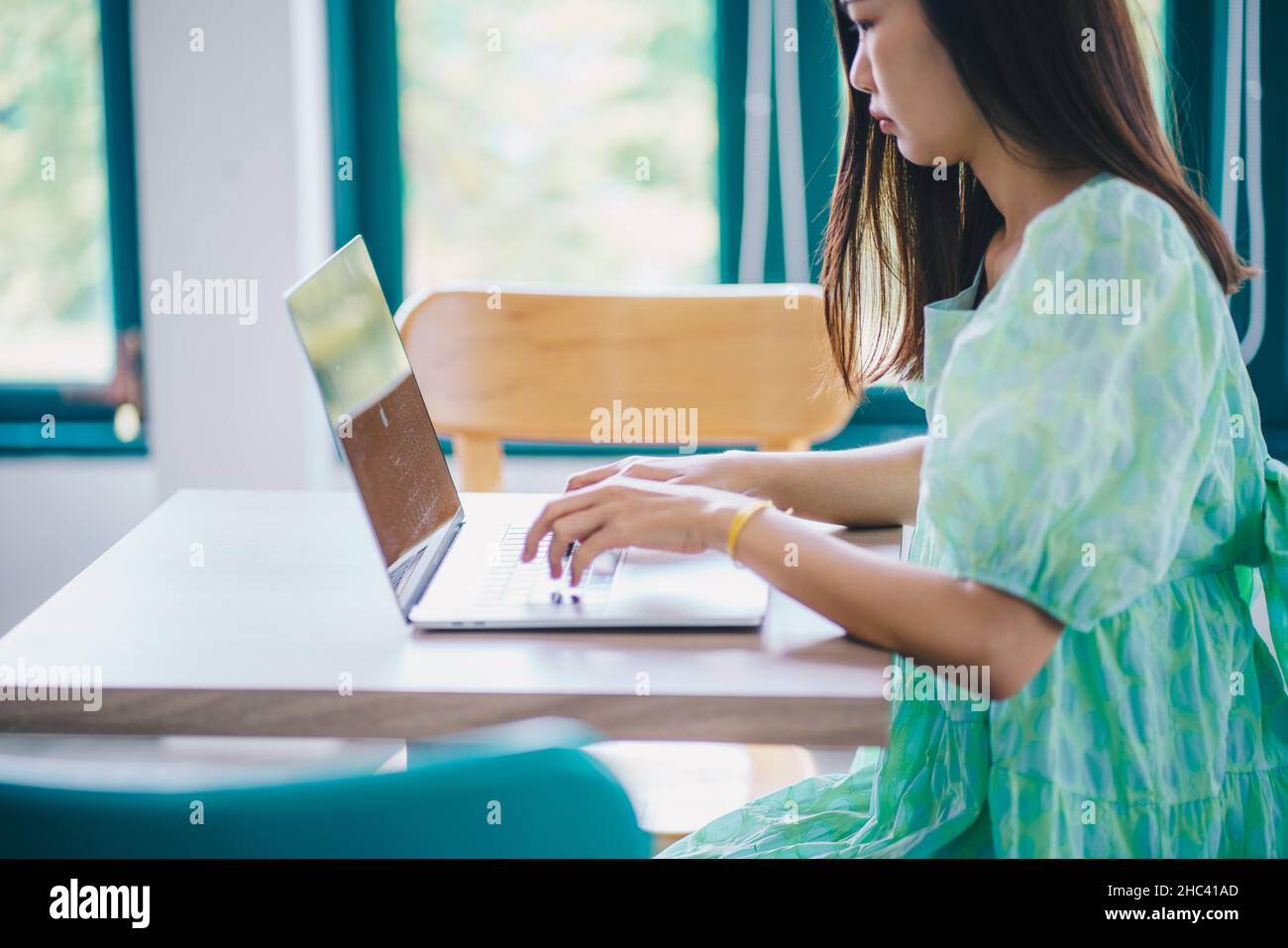 Beautiful women use laptop in modern cafe work from home Stock Photo ...