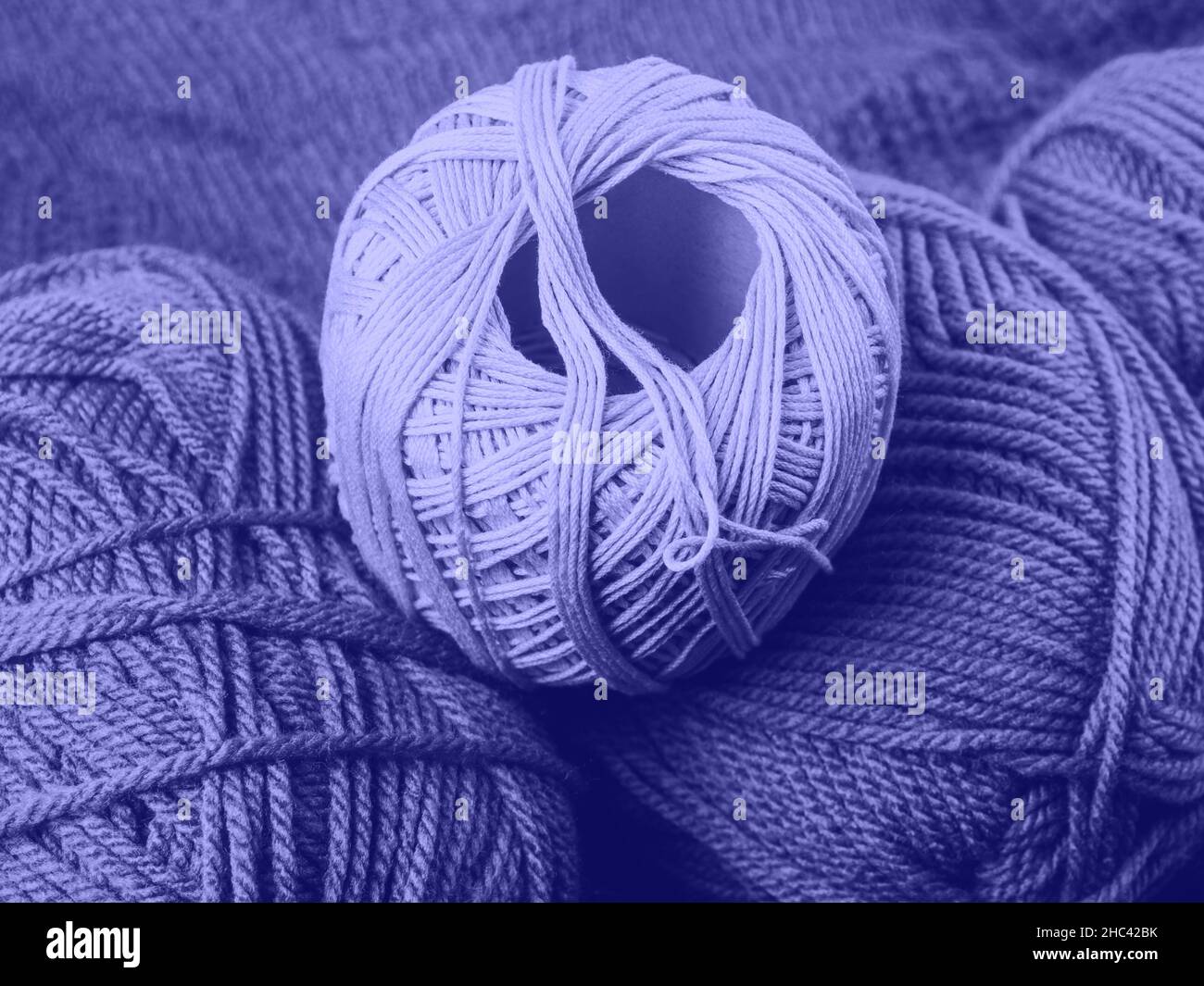Purple cotton and wool knitting yarn Stock Photo - Alamy