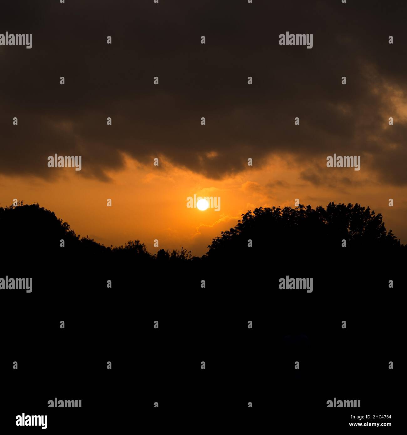 Beautiful bright sunrise over a hill silhouette Stock Photo - Alamy