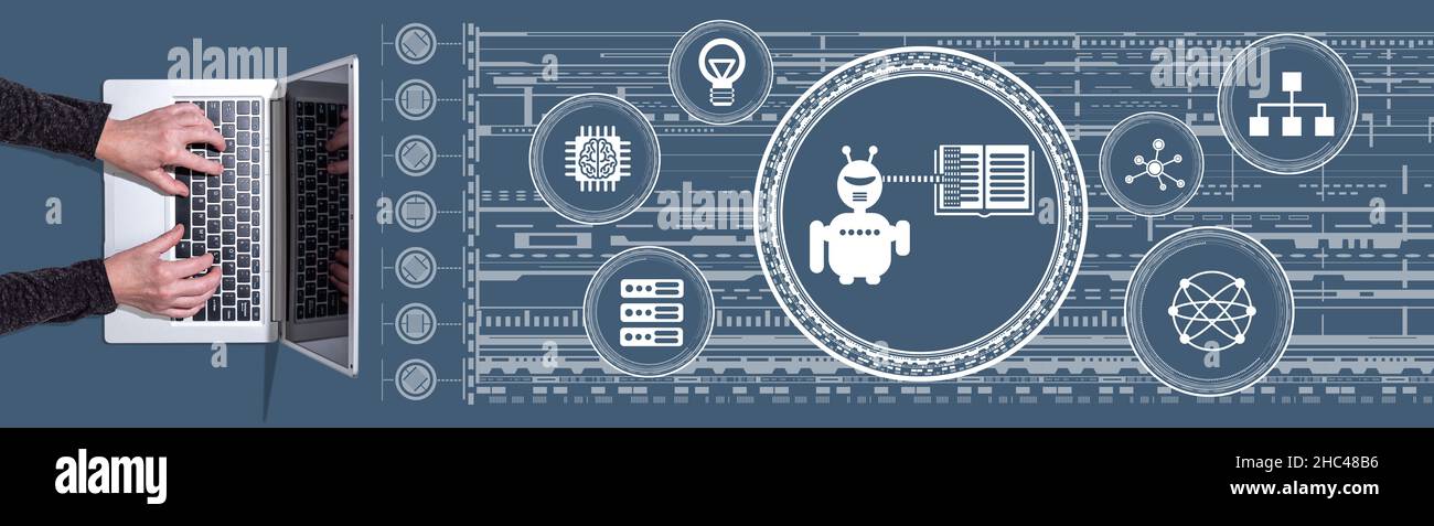 Top view of hands using laptop with symbol of machine learning concept ...